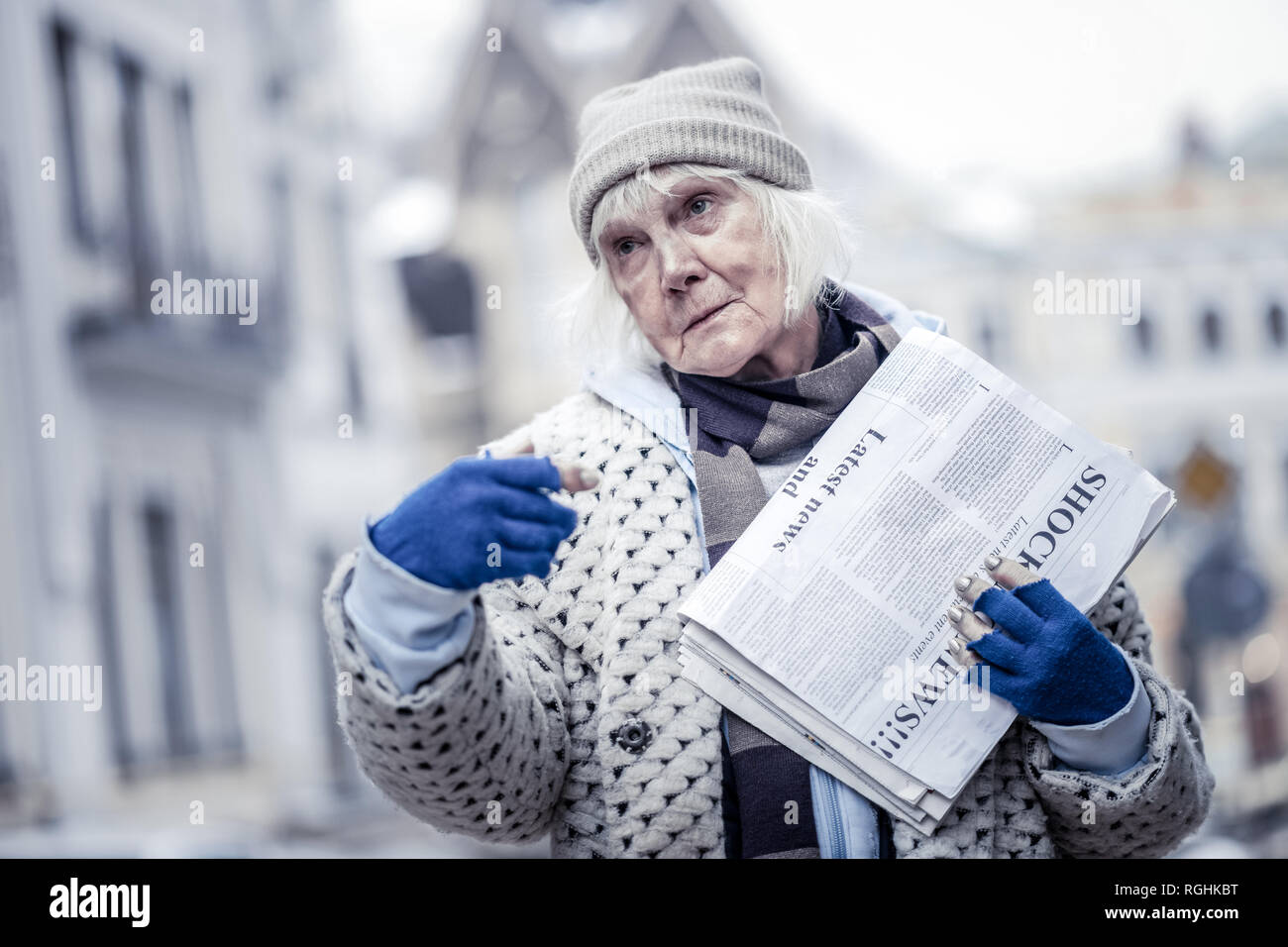 Woman selling newspapers hi-res stock photography and images - Alamy