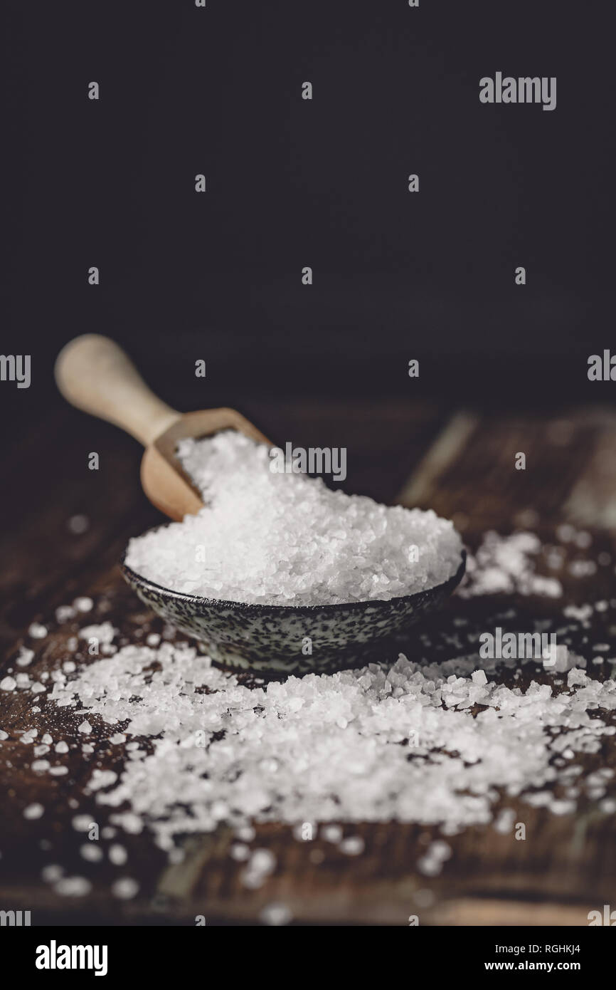 sea salt on a dark beautiful wooden background Stock Photo - Alamy
