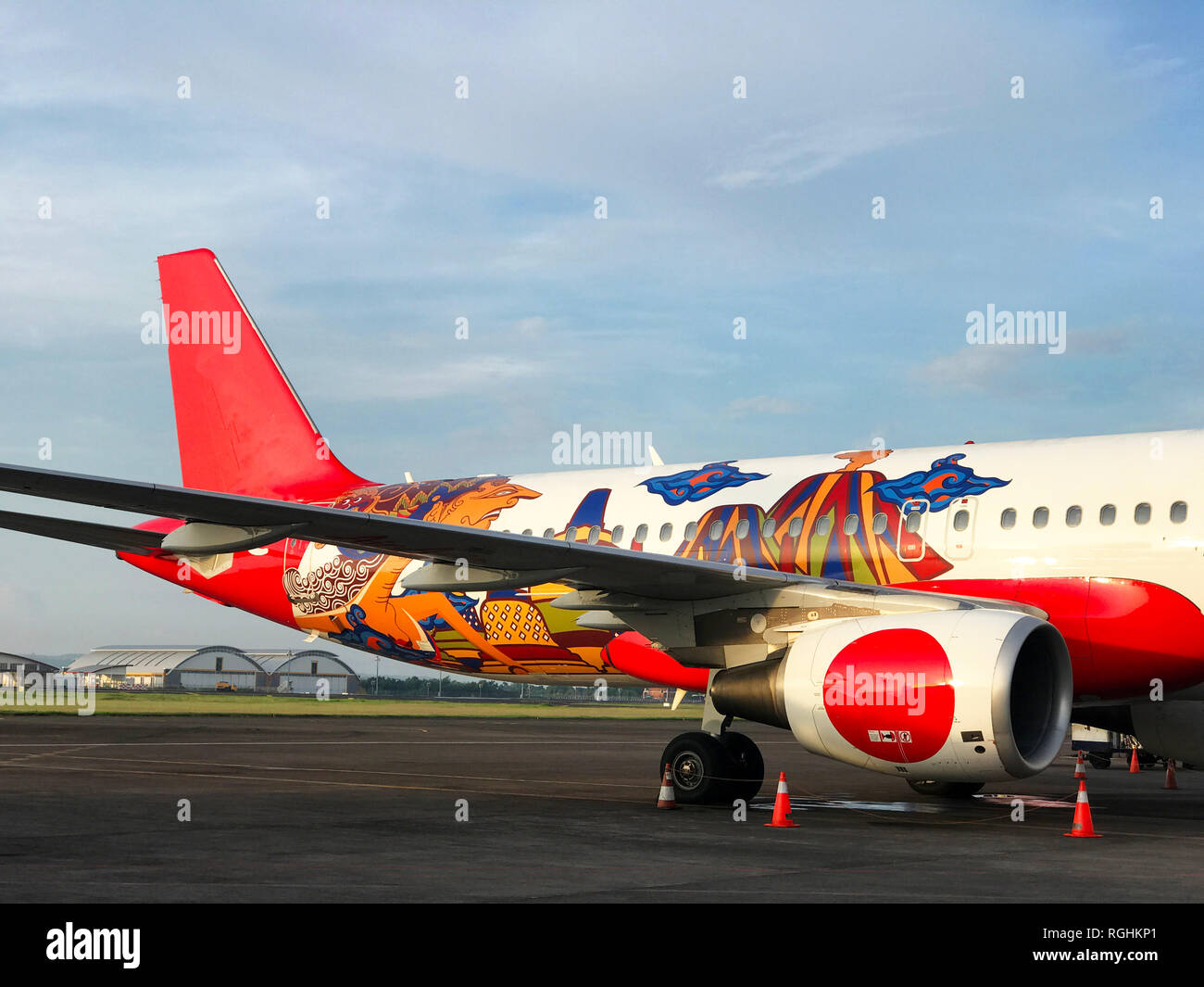 White-red plane on the runway Stock Photo - Alamy