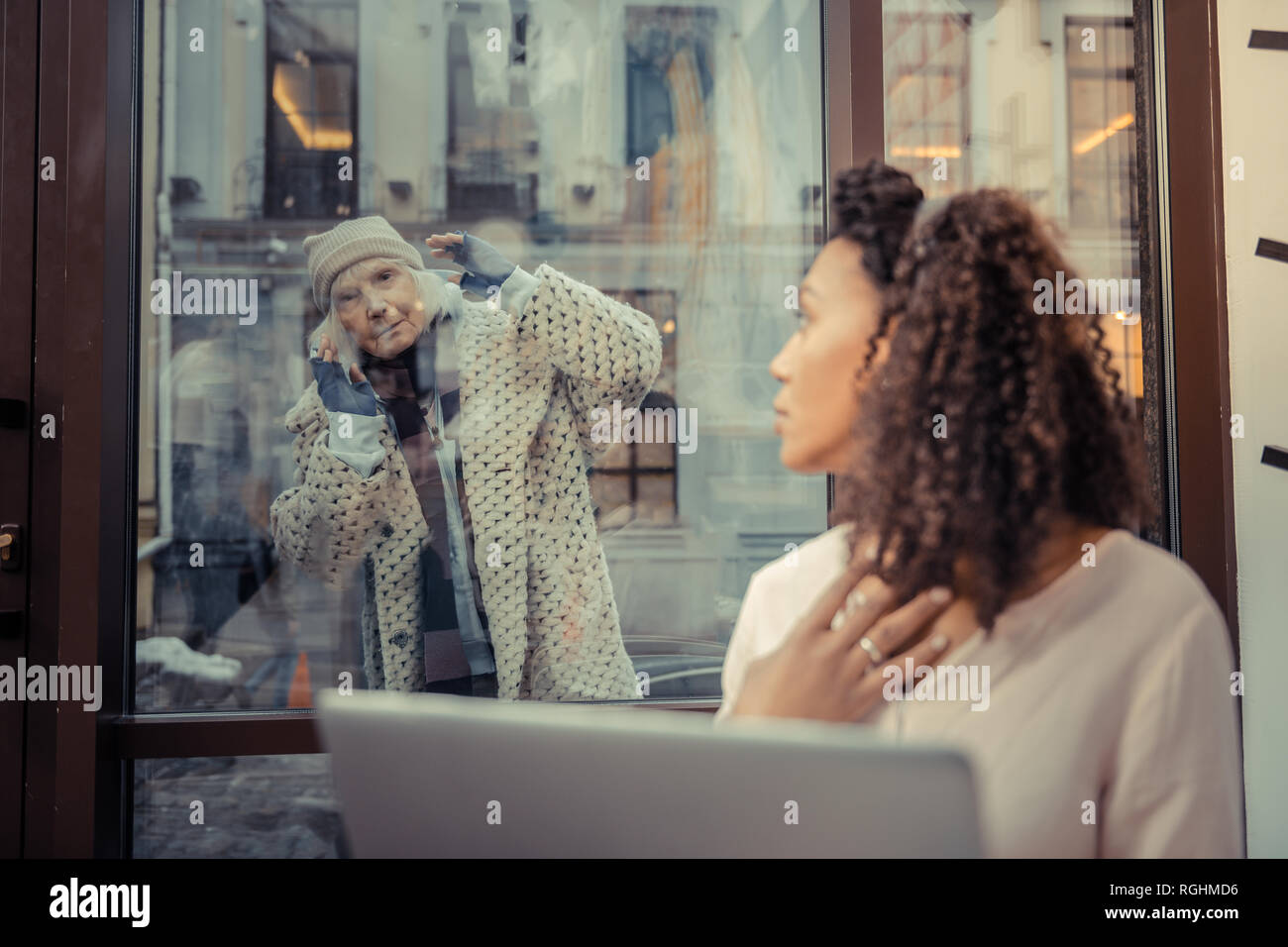 Nice sympathetic young woman wanting to help Stock Photo - Alamy