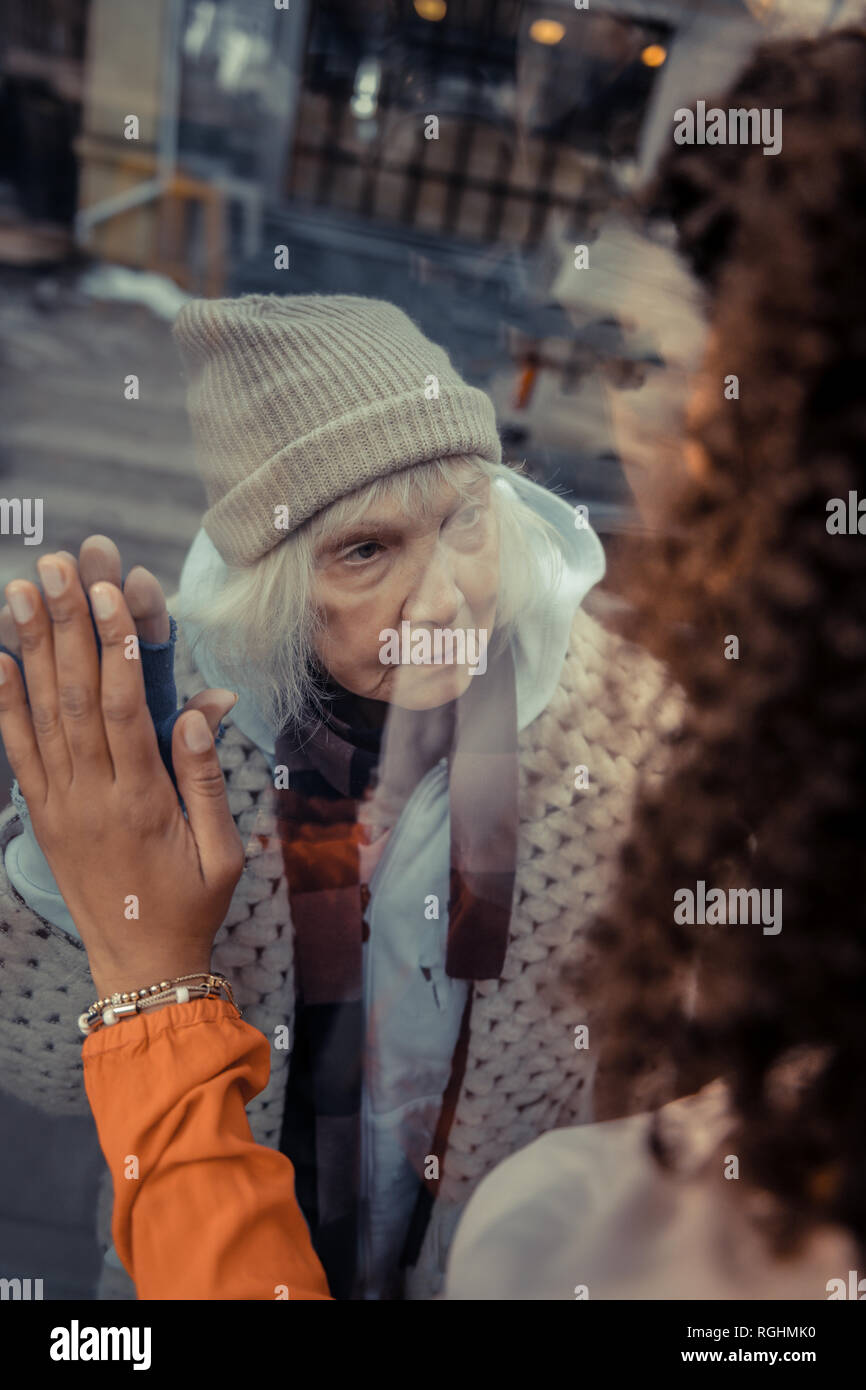 Close up of an unhappy homeless womans face Stock Photo - Alamy