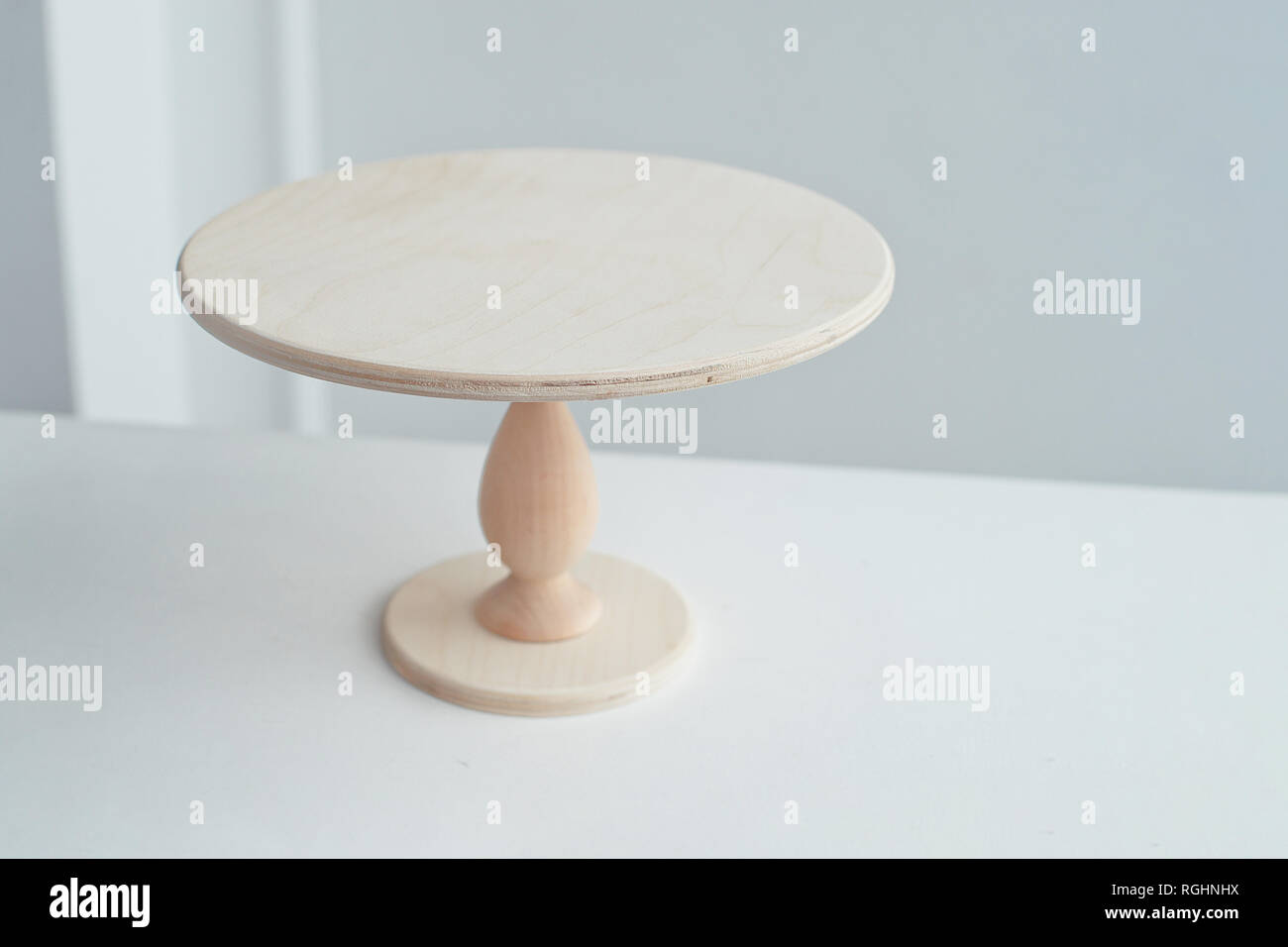 Empty wooden stand for cake isolated on white background Stock Photo ...