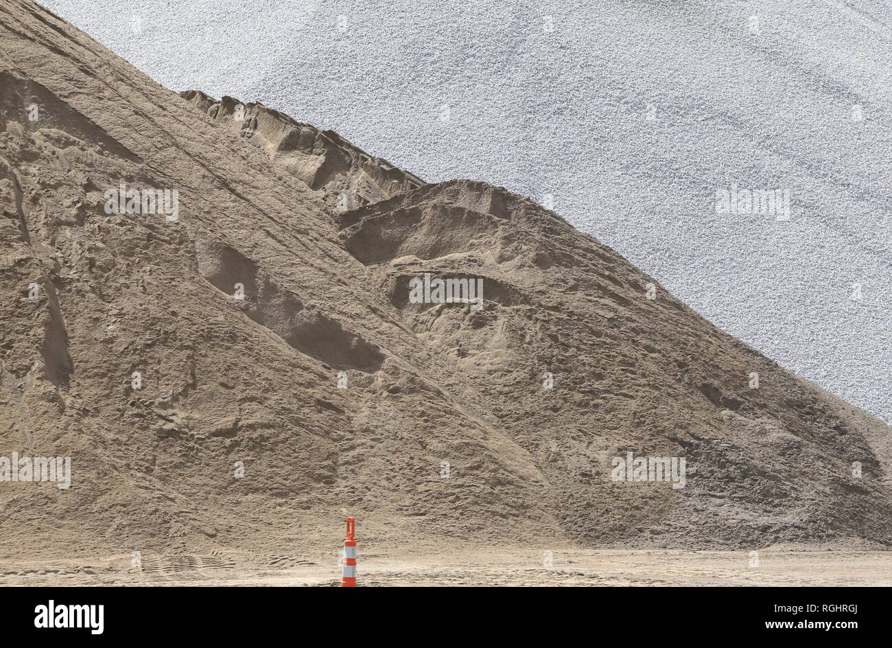 Large mounds of construction limestone gravel and sand Stock Photo - Alamy
