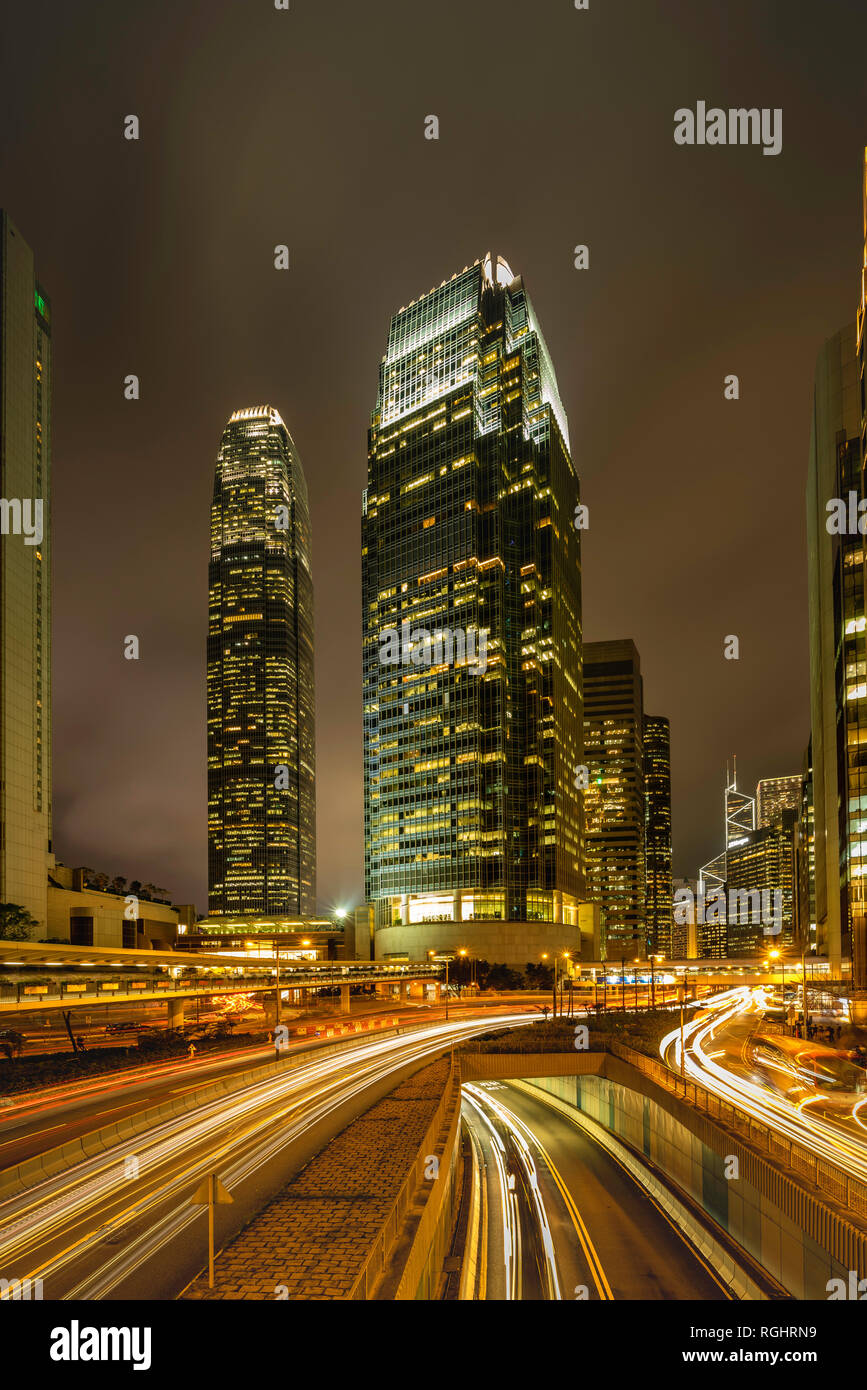 Traffic light trails, IFC1 and IFC2 buildings in Hong Kong, China, Asia ...