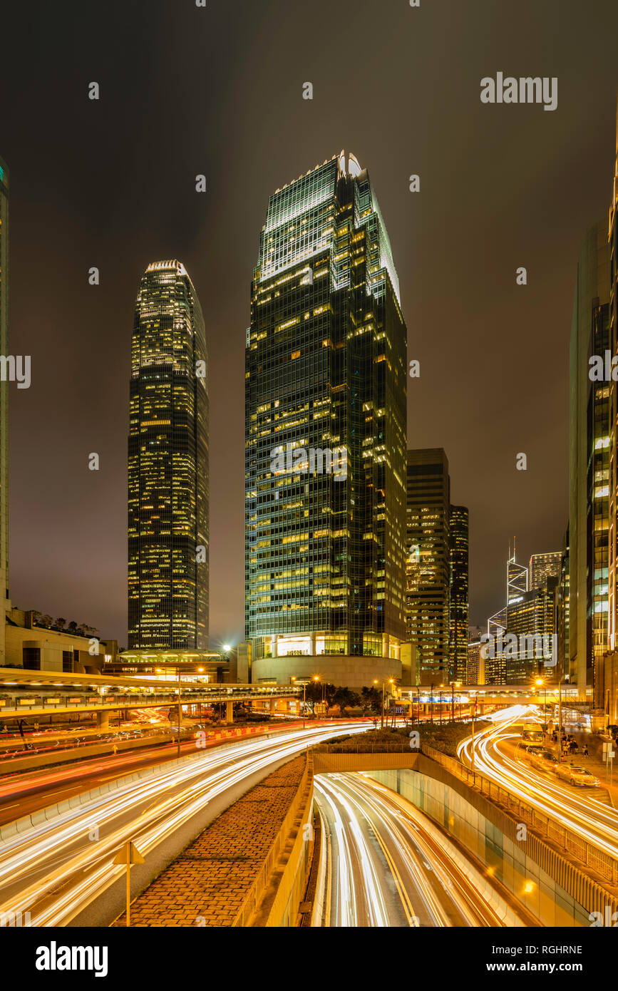Traffic light trails, IFC1 and IFC2 buildings in Hong Kong, China, Asia ...