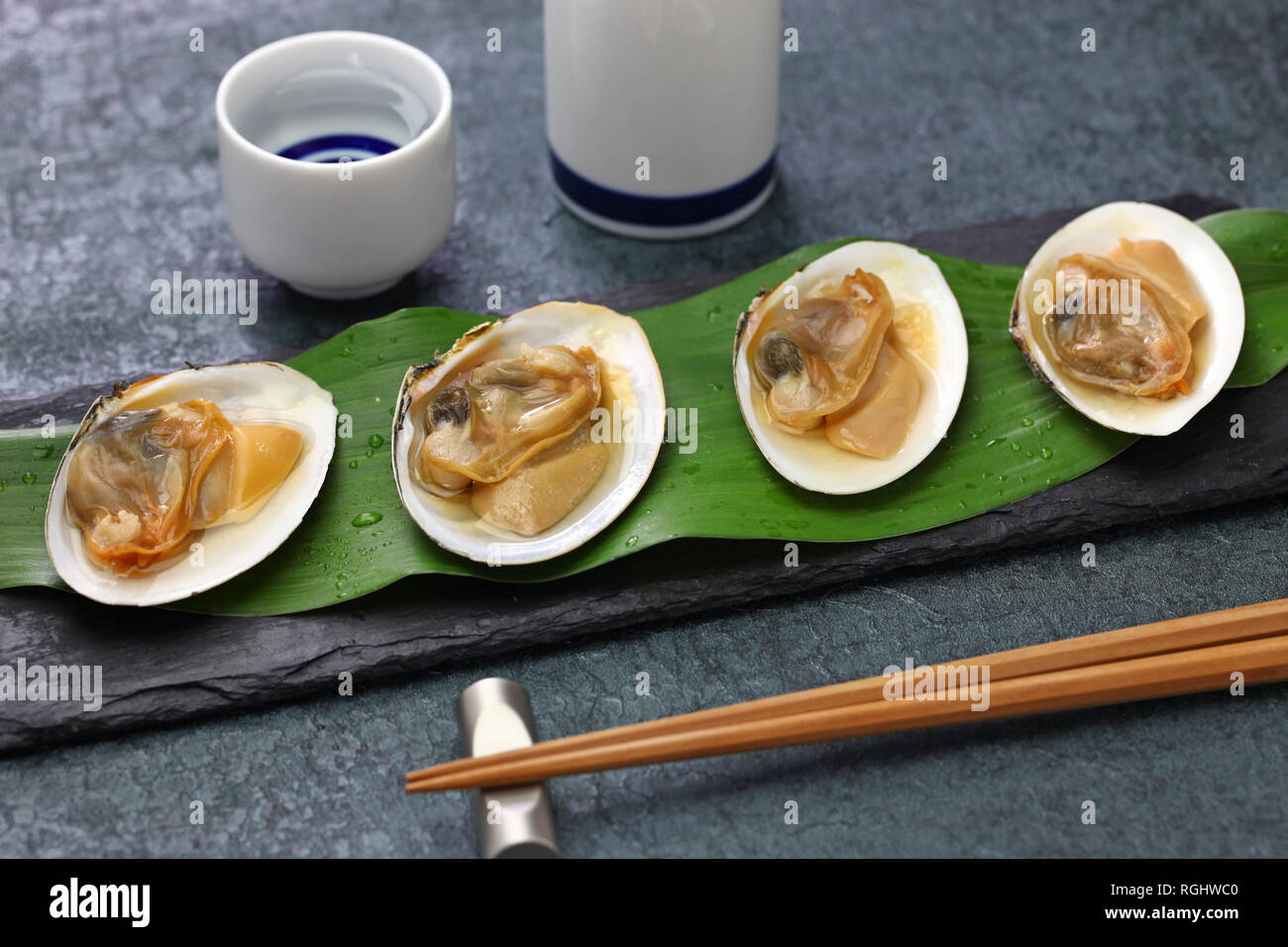 steamed saragai(northern great clams) with sake(japanese rice wine ...