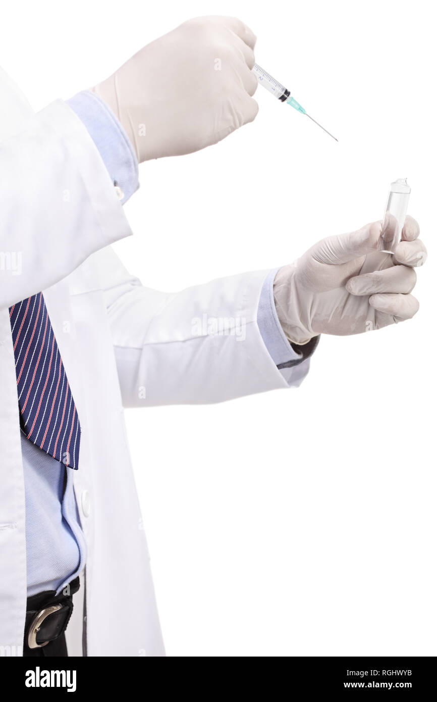 Doctor's hands preparing a syringe for a vaccine dose isolated on white ...