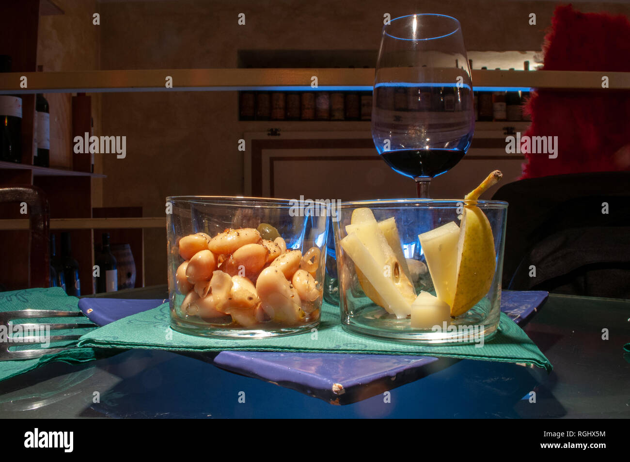 still life of aperitif with beans, pears and a glass of red wine Stock ...