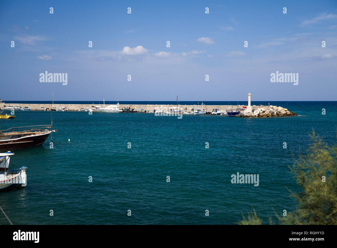 Harbor in Hersonissos. Island of Crete in Greece. Blue sea and pier ...