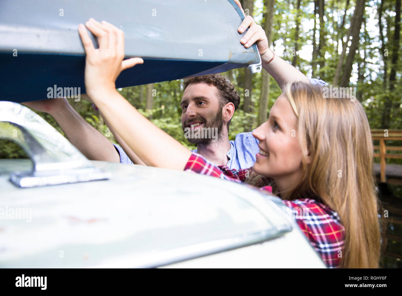 Active couple taking canoe hi-res stock photography and images - Alamy