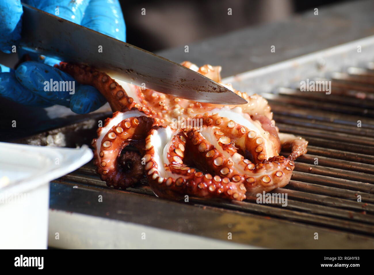 food preparation, grilled octopus Stock Photo - Alamy