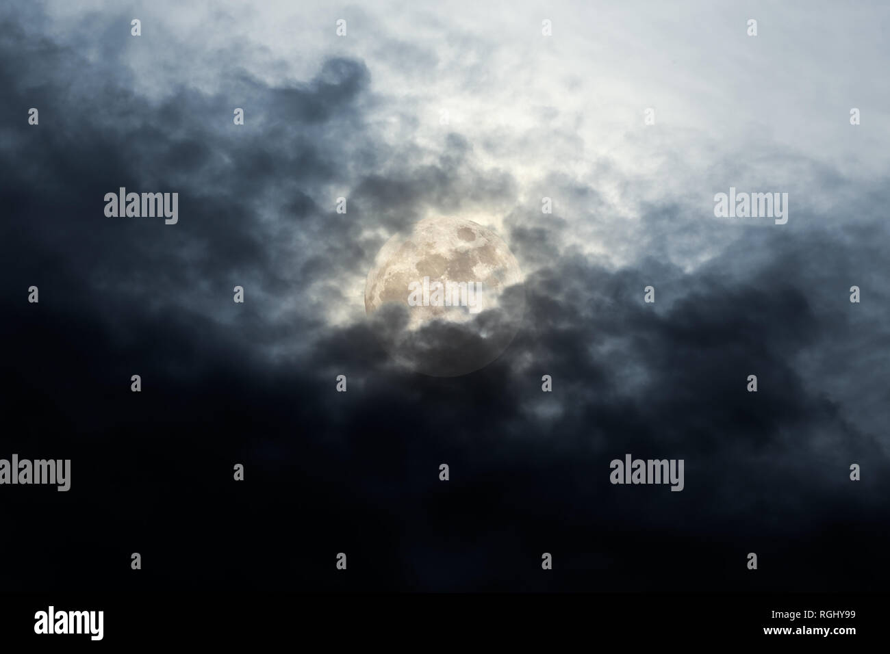 Full moon in an overcast night Stock Photo - Alamy