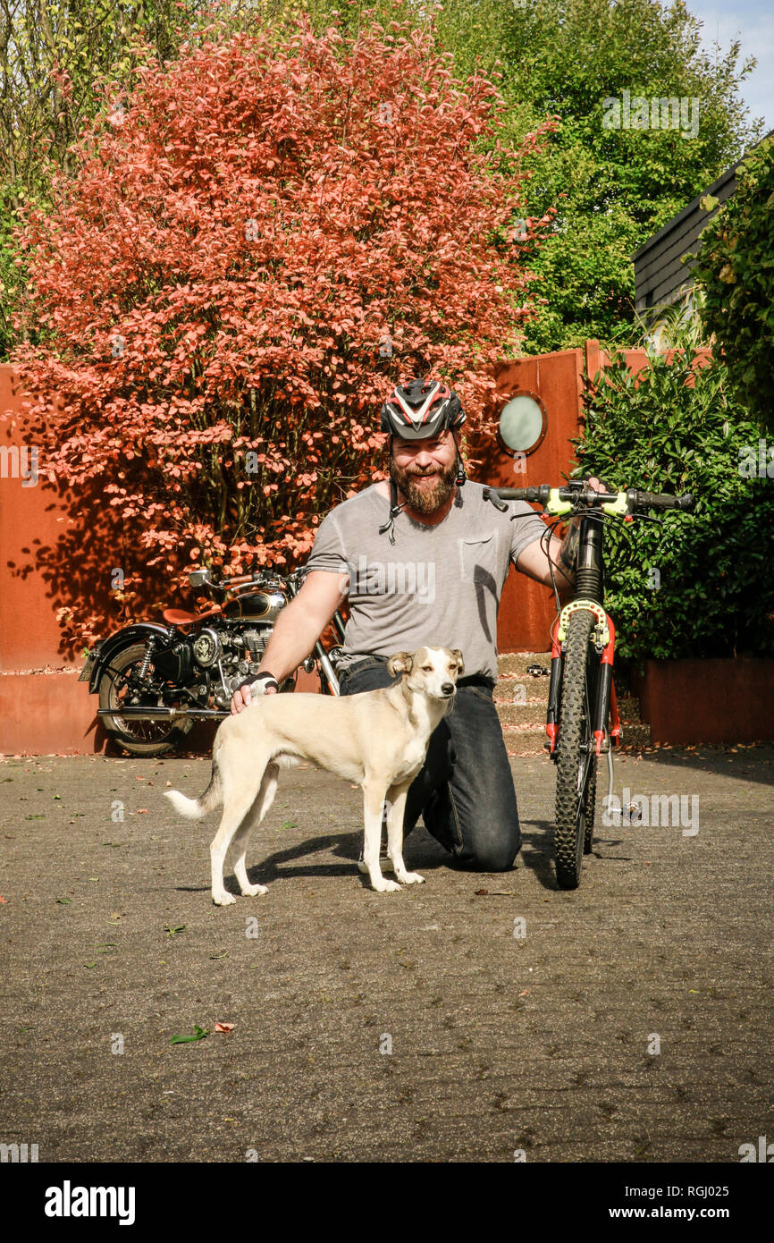 Portrait smiling man dog bicycle hi-res stock photography and images ...