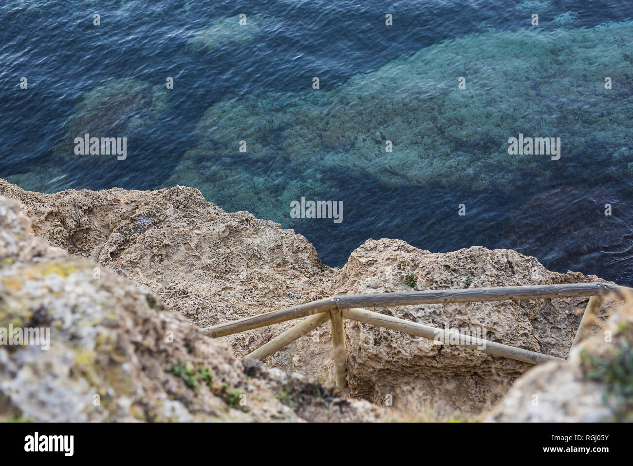 Top view of the beautiful blue ocean by the cliff and rocks Stock Photo ...