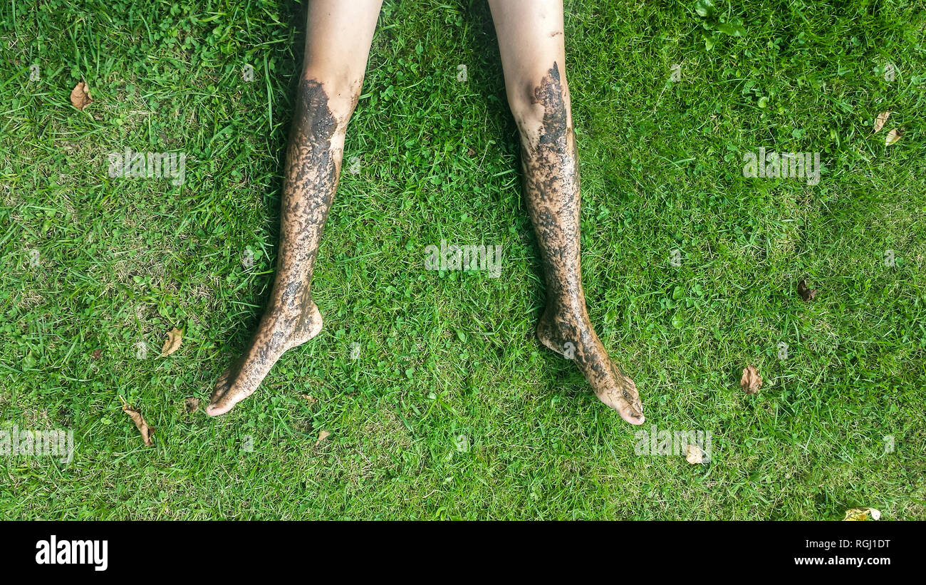 Top view legs of pretty young woman relaxing on grass Stock Photo - Alamy