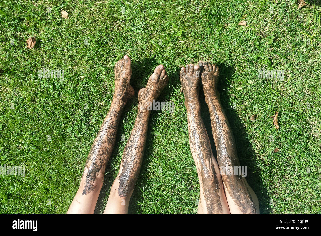Top view legs of pretty young woman relaxing on grass Stock Photo - Alamy