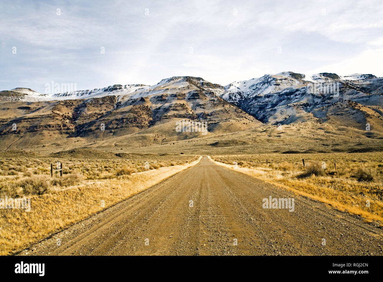 A narrowl road in the rural countryside of the Oregon Outback near the ...