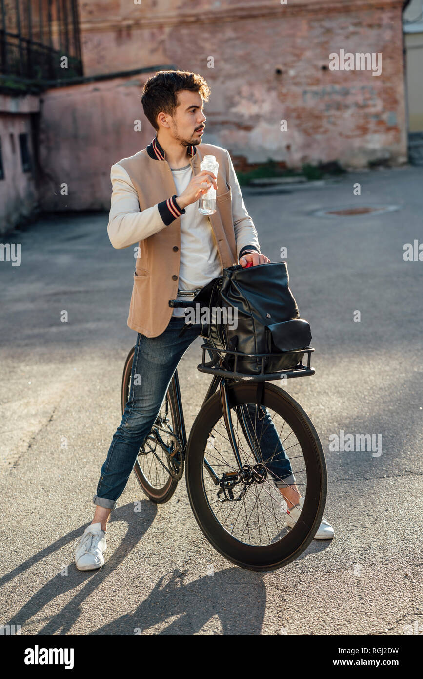 Commuter on bike back view hi-res stock photography and images - Alamy