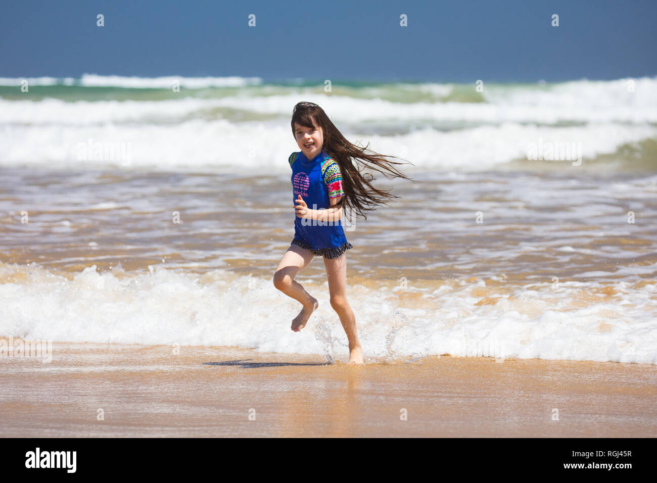 Happy kids at beach hi-res stock photography and images - Alamy