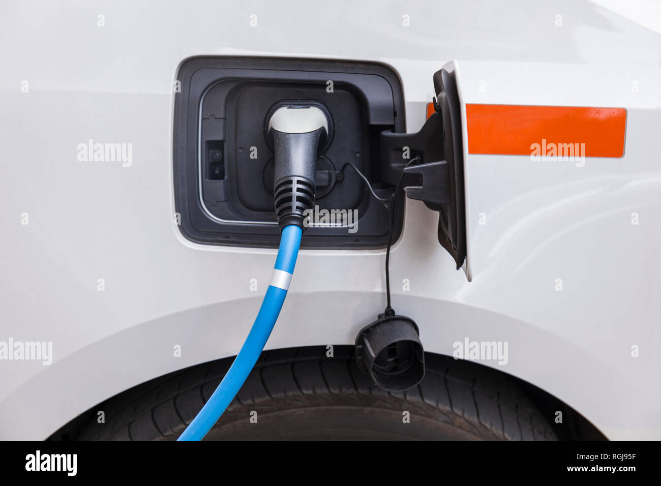 Electric car recharging Stock Photo - Alamy