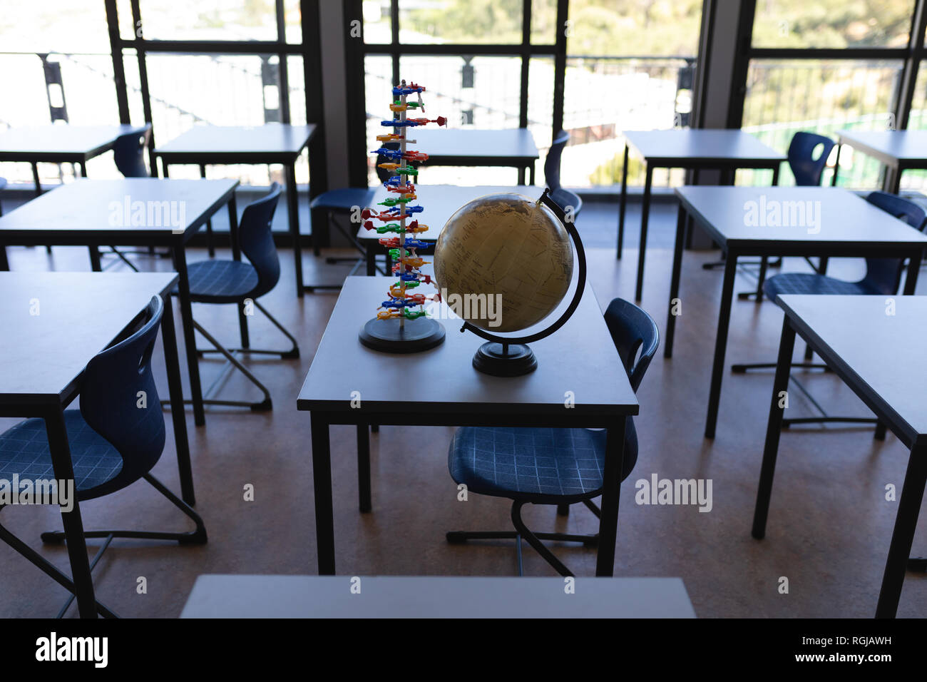 Globe and DNA model for children on a table Stock Photo - Alamy