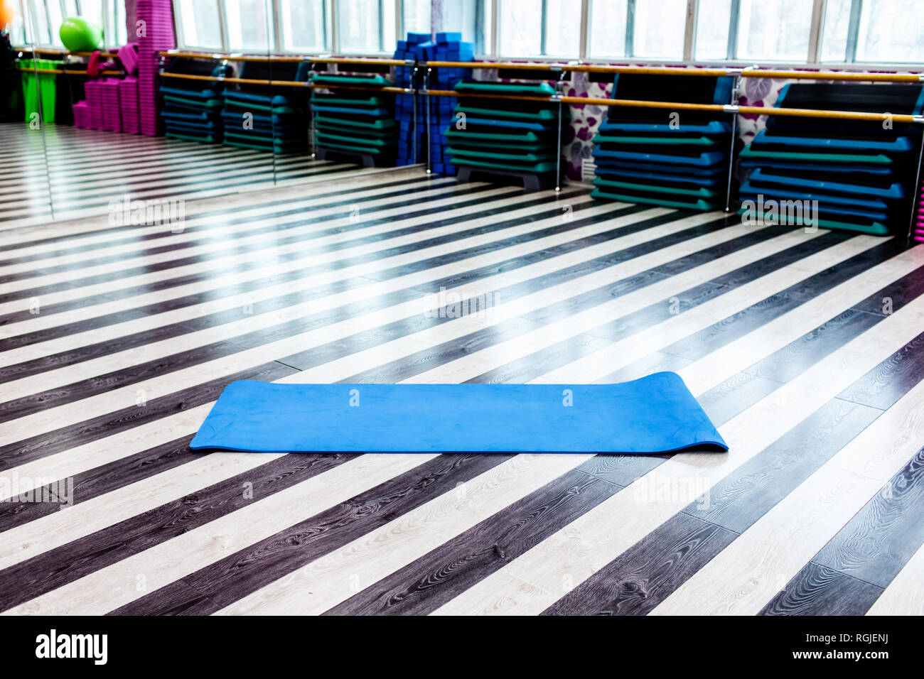 Empty yoga mat on the floor Stock Photo - Alamy