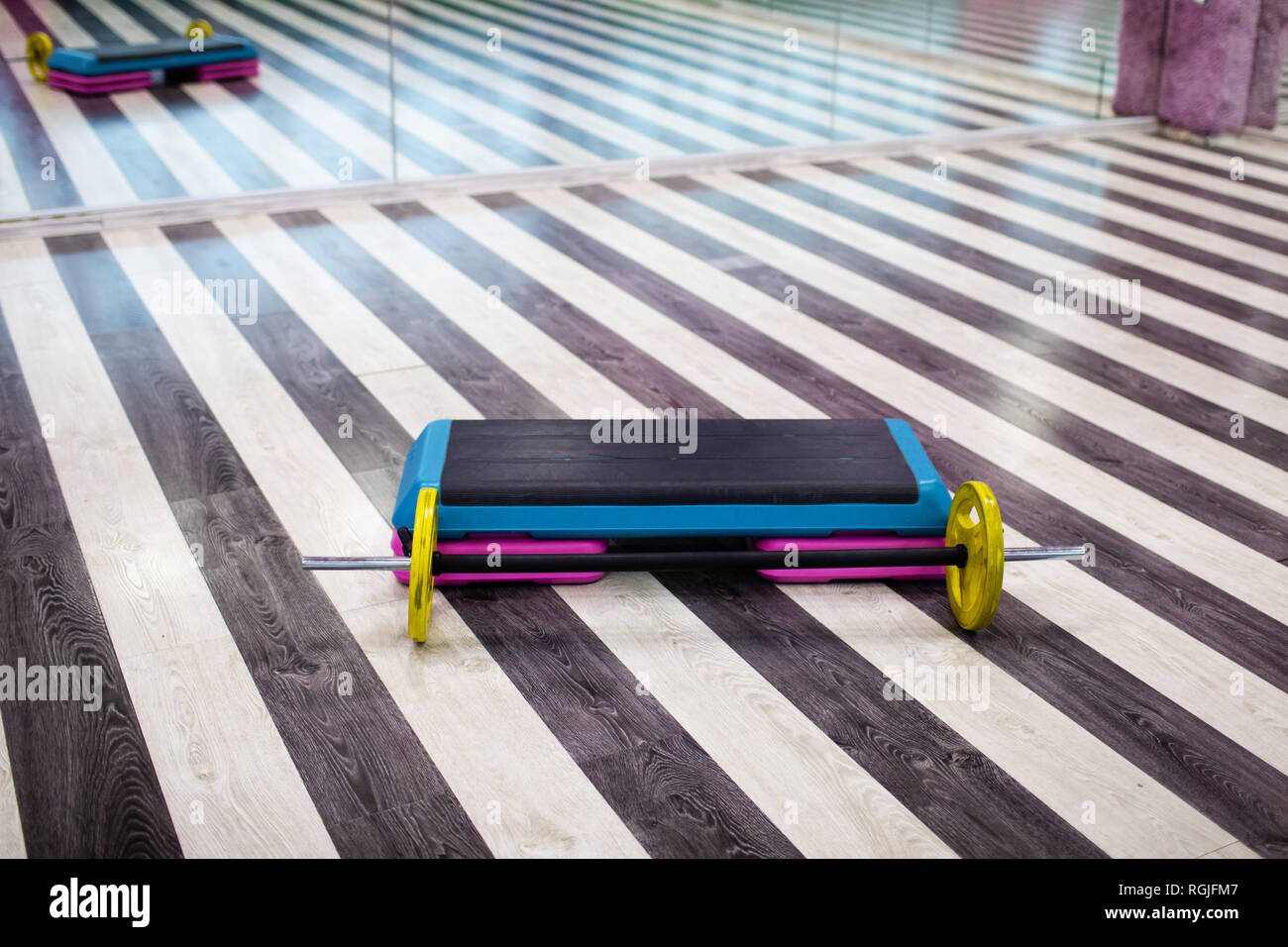 Gym with step platform on the floor Stock Photo - Alamy