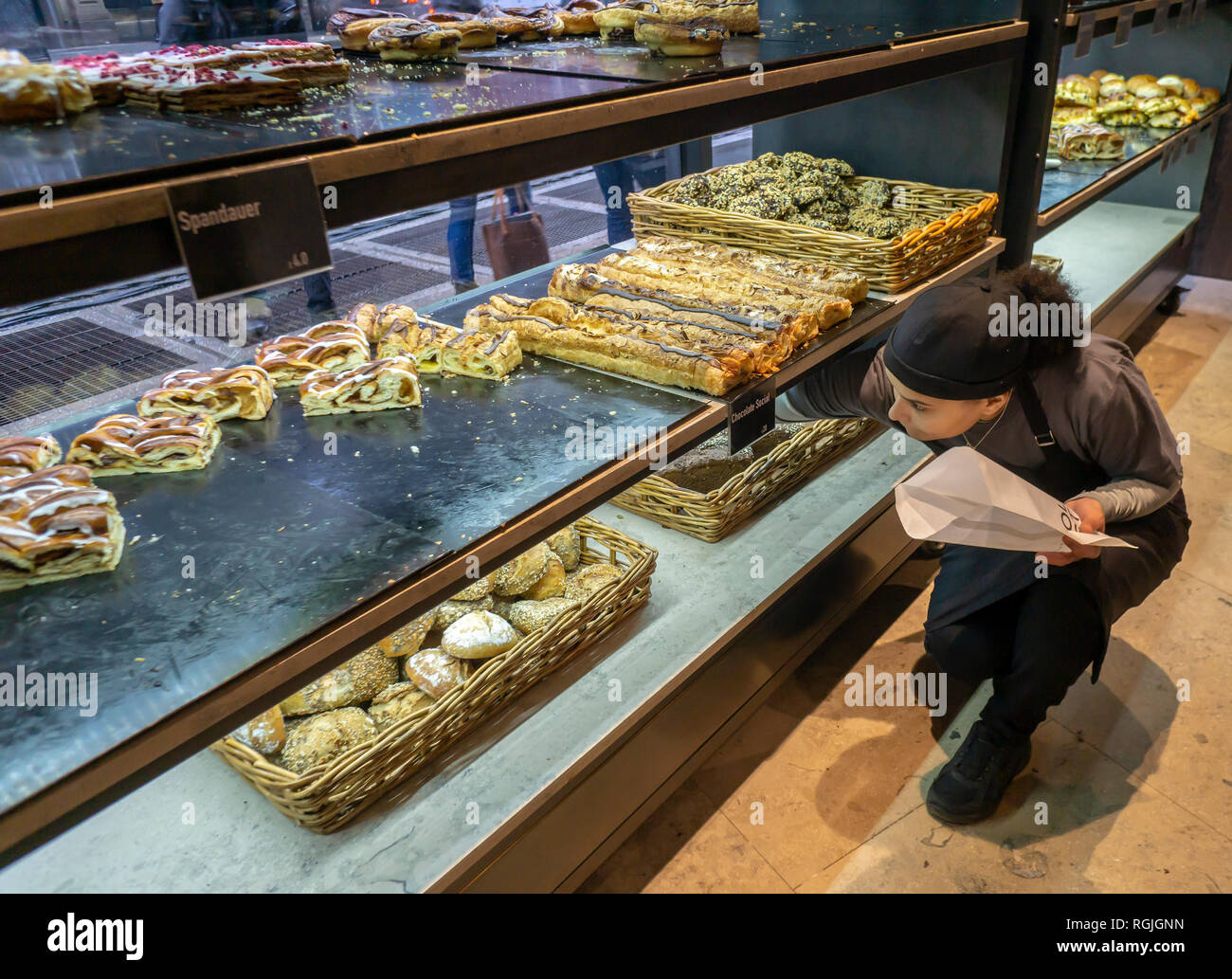 A worker assists a customer in their choice at the first U.S. location ...