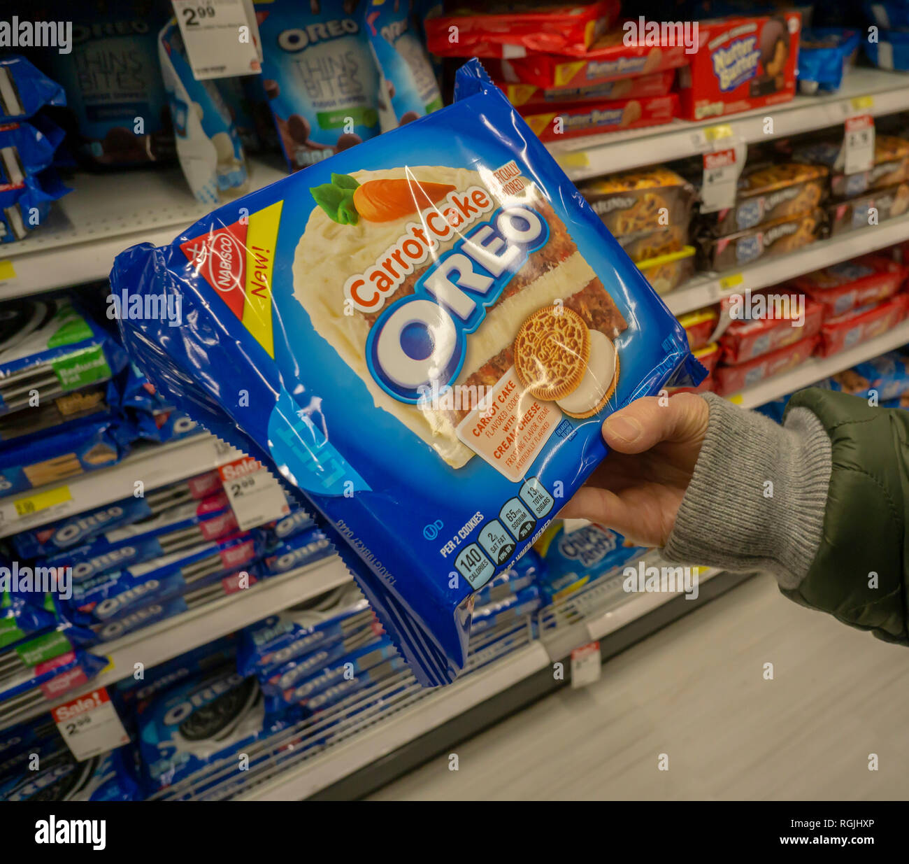 A hungry shopper chooses a package of Mondelez International's Nabisco ...