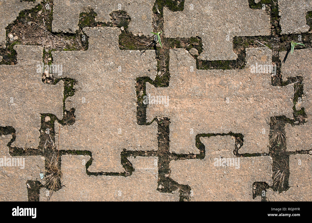 Sidewalk made out of puzzle piece shapes of stone Stock Photo - Alamy