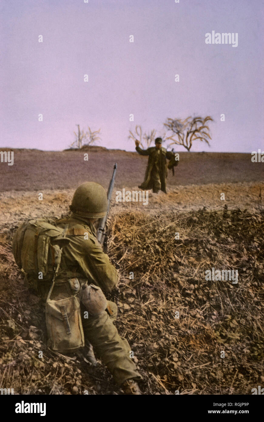 Infantryman Covering a German as he Surrenders, Central Europe Campaign ...