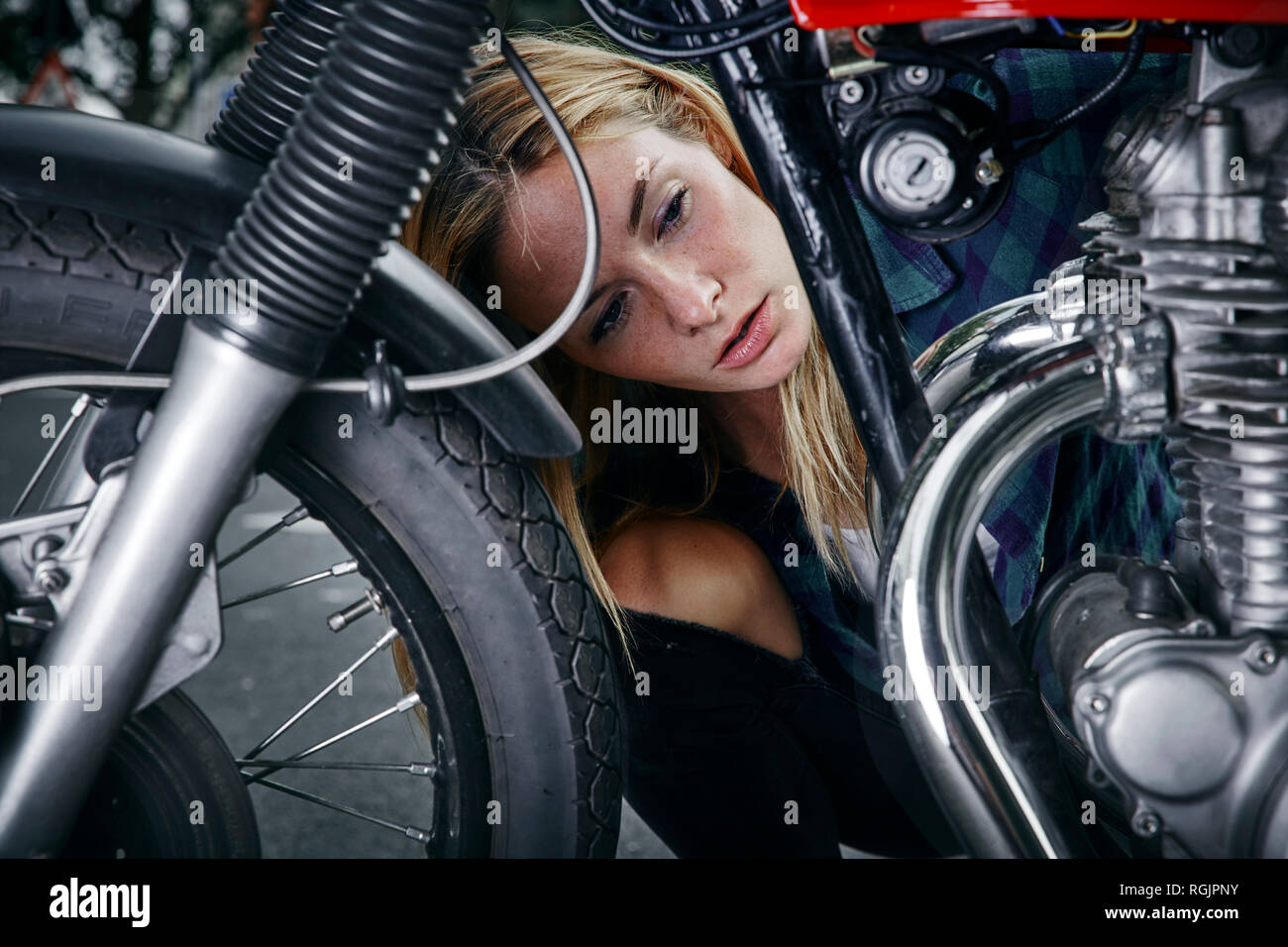 Woman working on motorcycle hi-res stock photography and images - Alamy