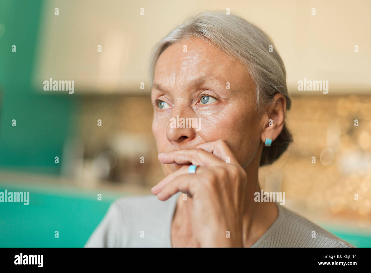 Portrait of pensive senior woman Stock Photo - Alamy