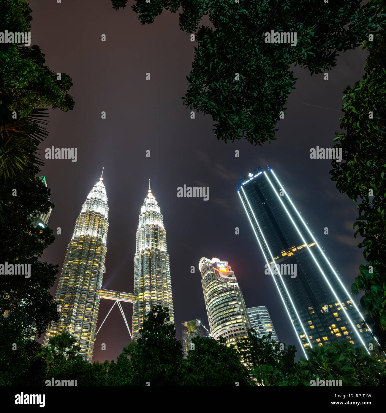 The KLCC park at night with The Petronas twin towers in the background ...