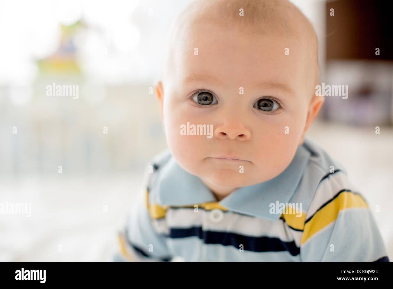 Portrait of a cute smiling infant baby boy. Happy childhood concept ...