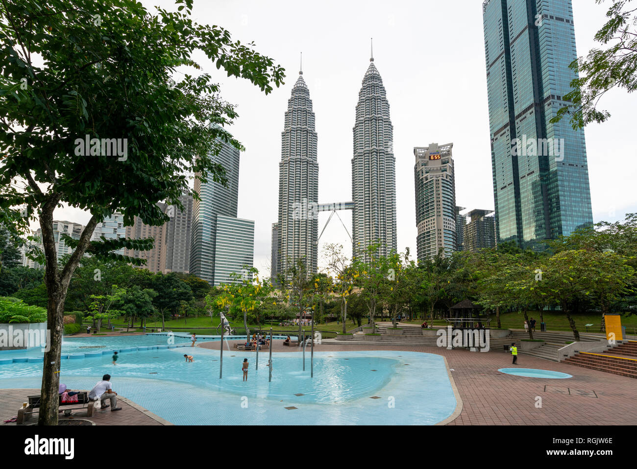 A pool in KLCC park with the Petronas twin towers in the backcground in ...