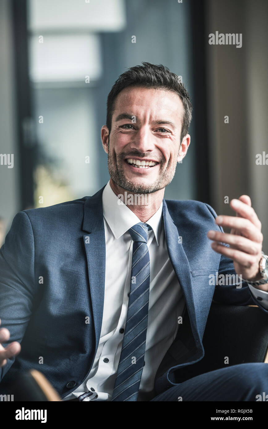 Satisfied smiling businessman looking camera hi-res stock photography ...