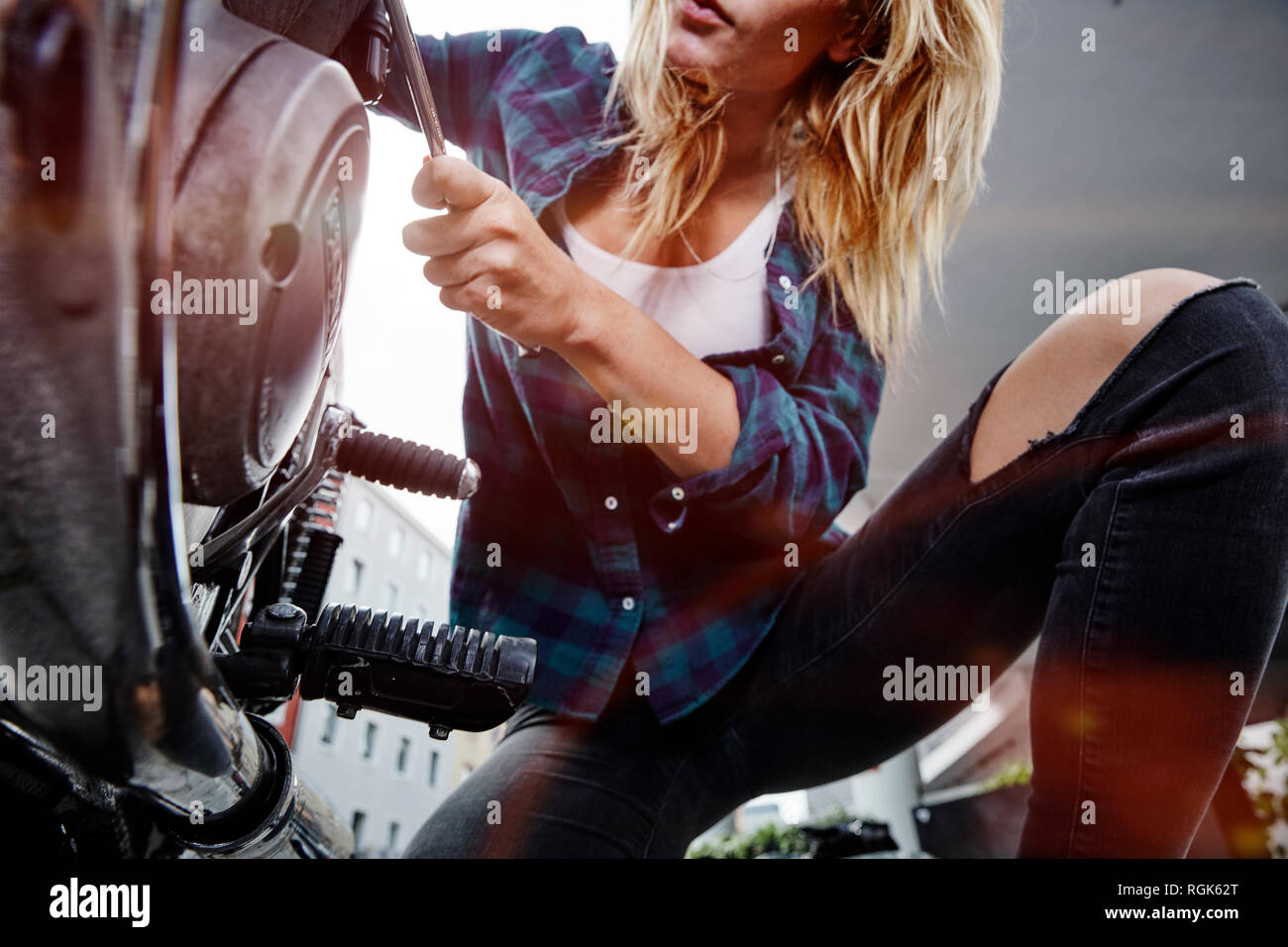 Woman working on motorcycle hi-res stock photography and images - Alamy