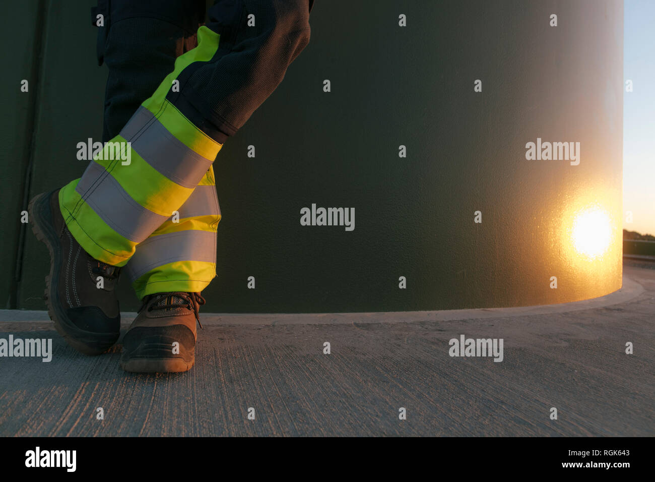 Legs of an engineer standing at a wind turbine tower Stock Photo - Alamy