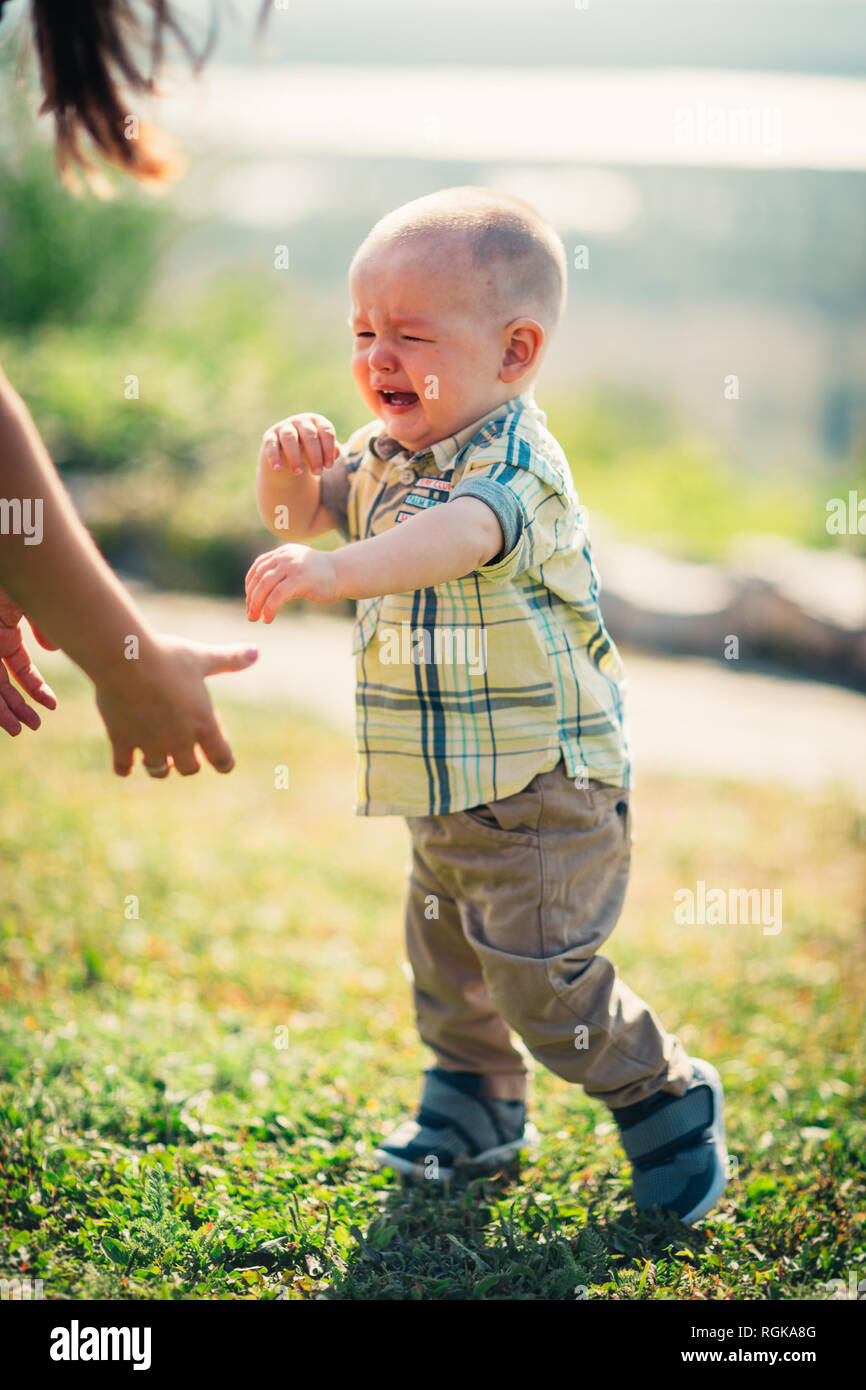 Toddler crying arms hi-res stock photography and images - Alamy