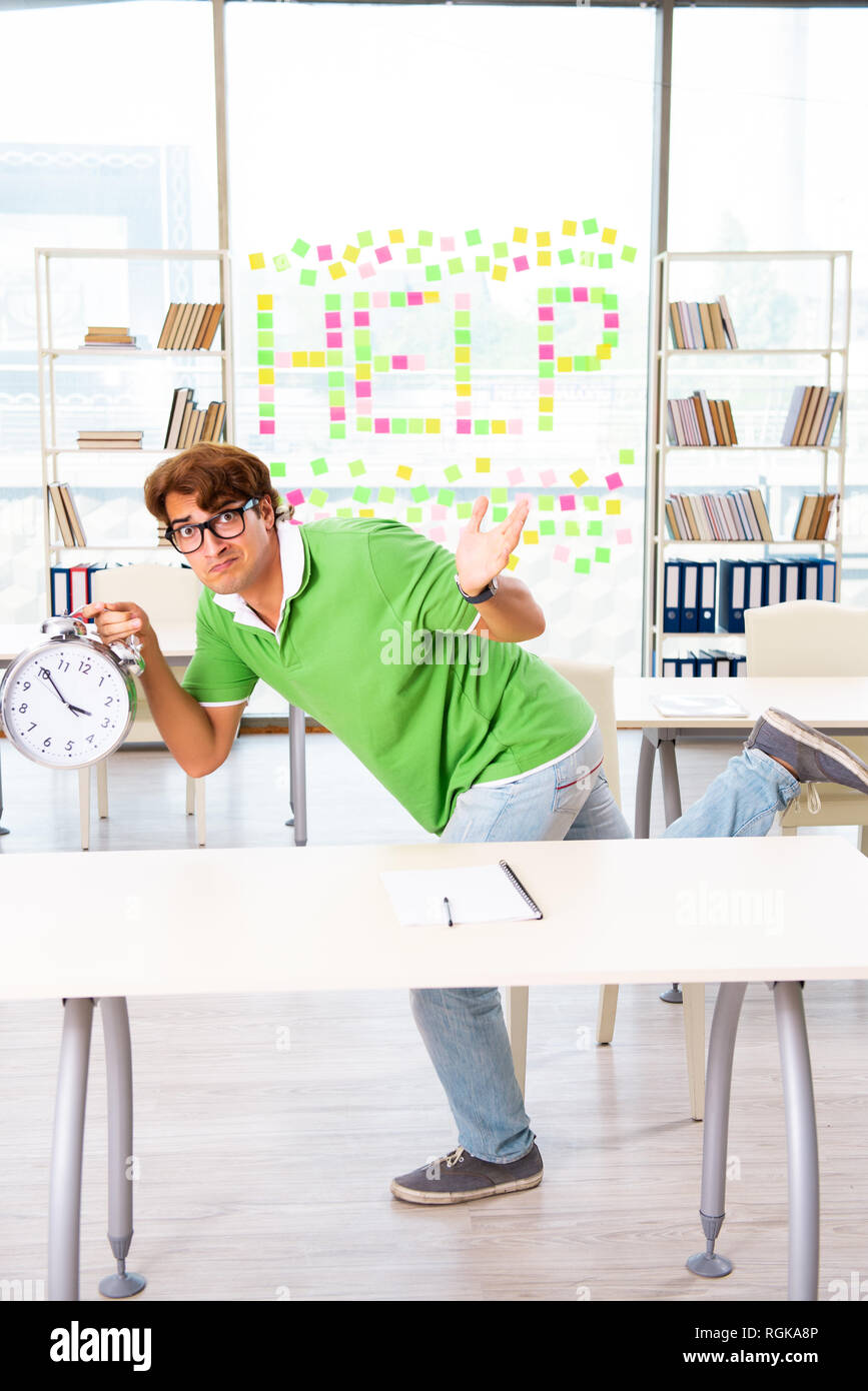 Student struggling at the exam in classroom Stock Photo - Alamy