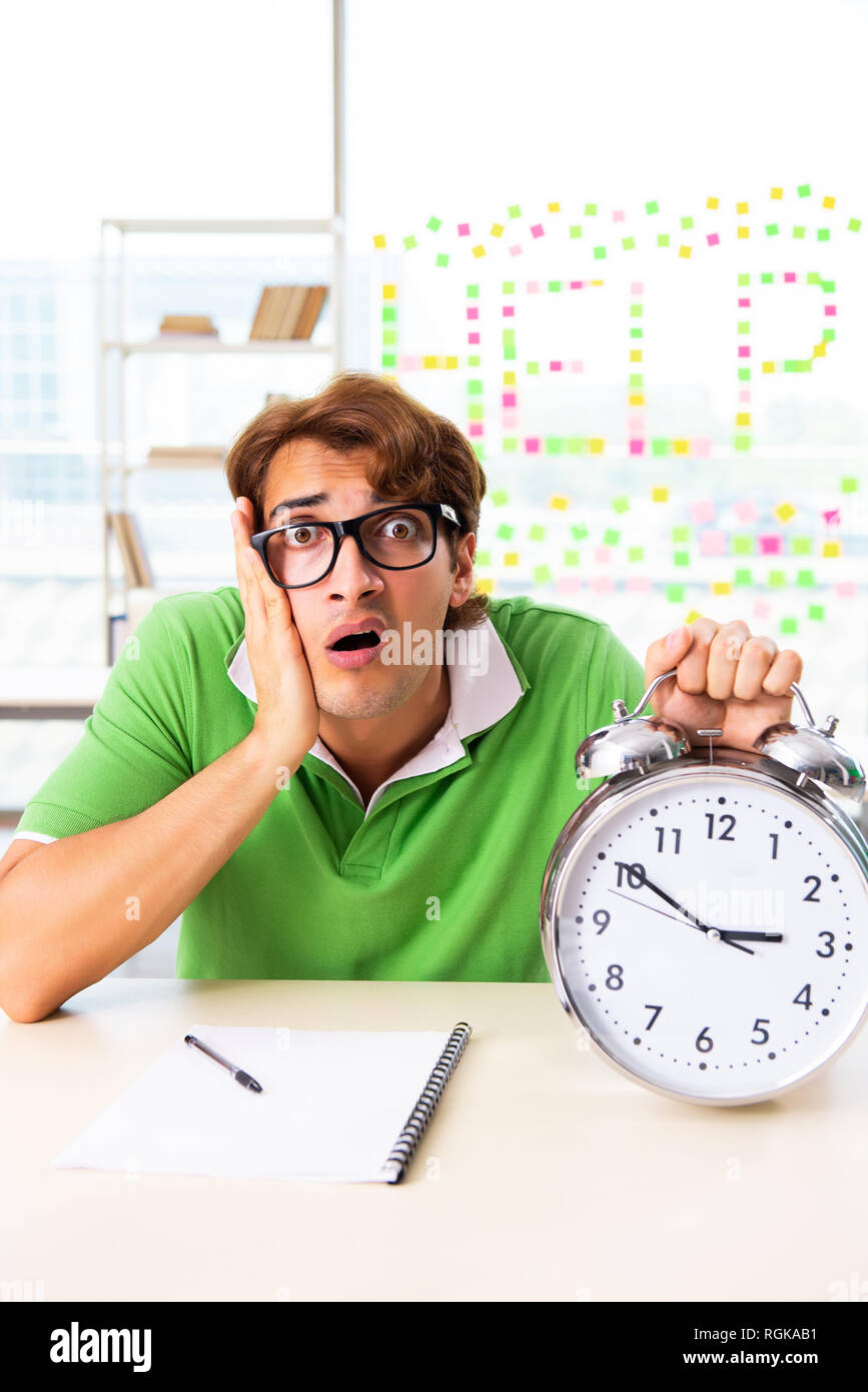 Student struggling at the exam in classroom Stock Photo - Alamy