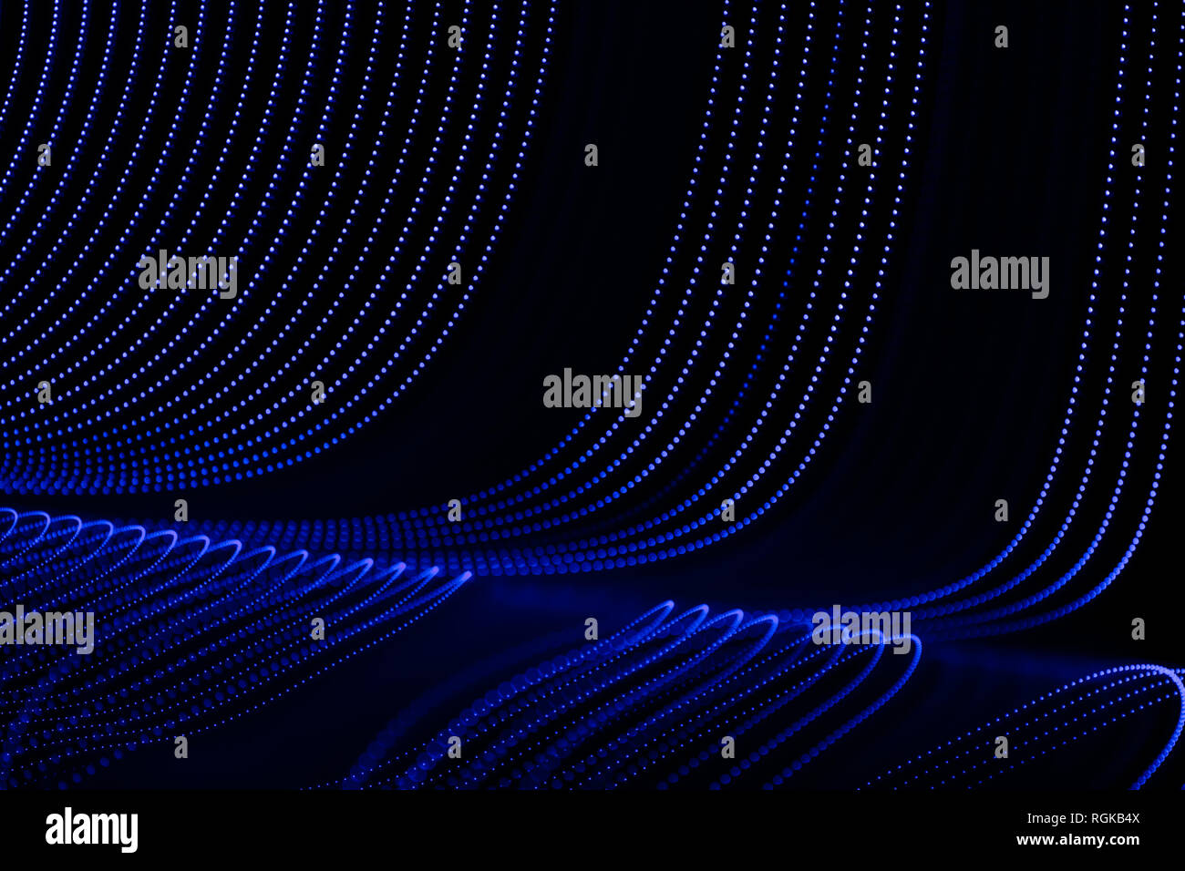 Blue curved lines of abstract points. Light painting photography Stock ...