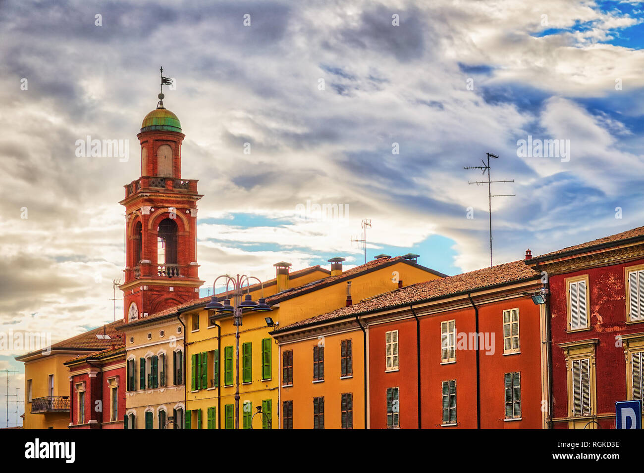 clock tower and colorful buildings in ancient hamlet of Italian village ...