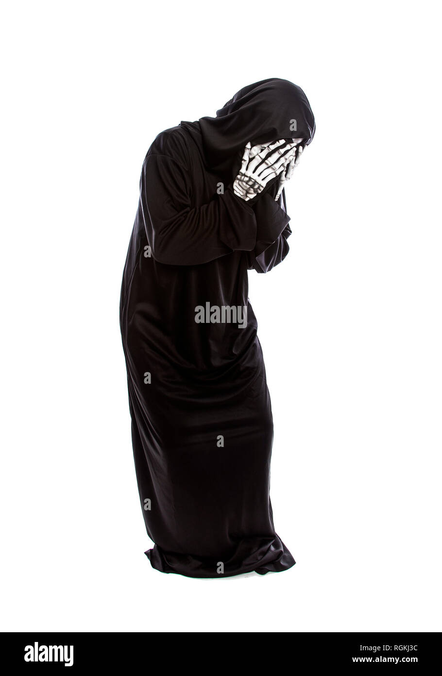 Halloween costume of a skeleton grim reaper wearing a black robe on a ...