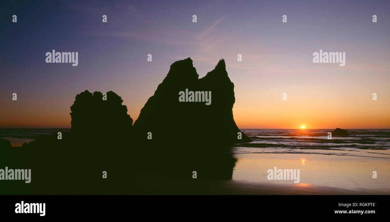 USA, Oregon, Arcadia Beach State Park, Sunset wet sand and sea stacks ...