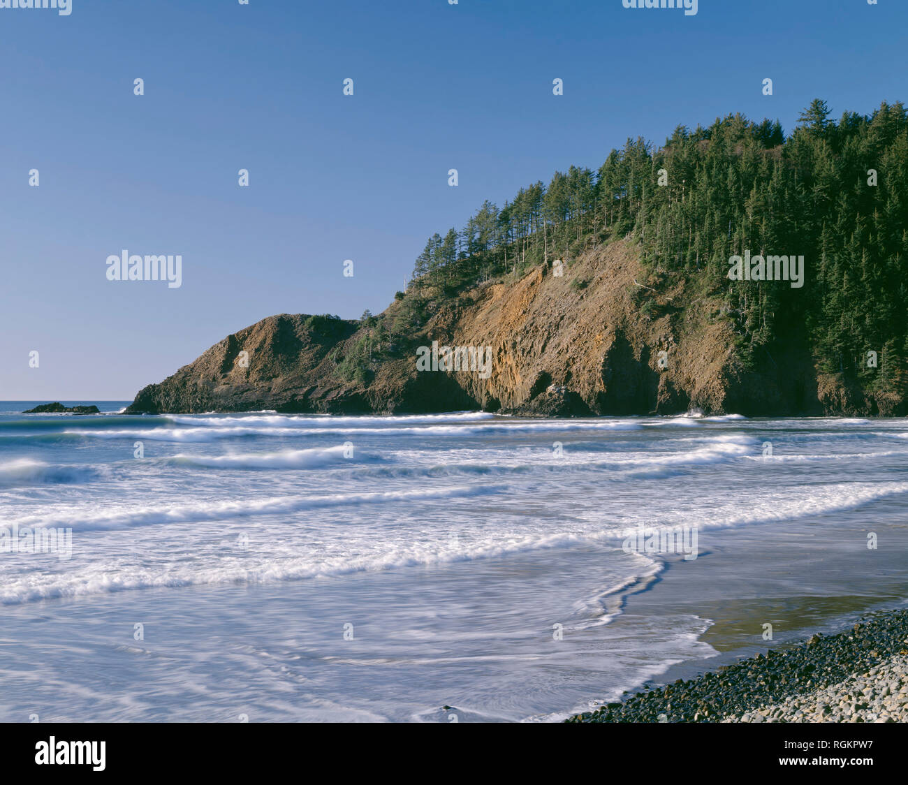 USA, Oregon, Ecola State Park, Indian Point reaches towards incoming ...