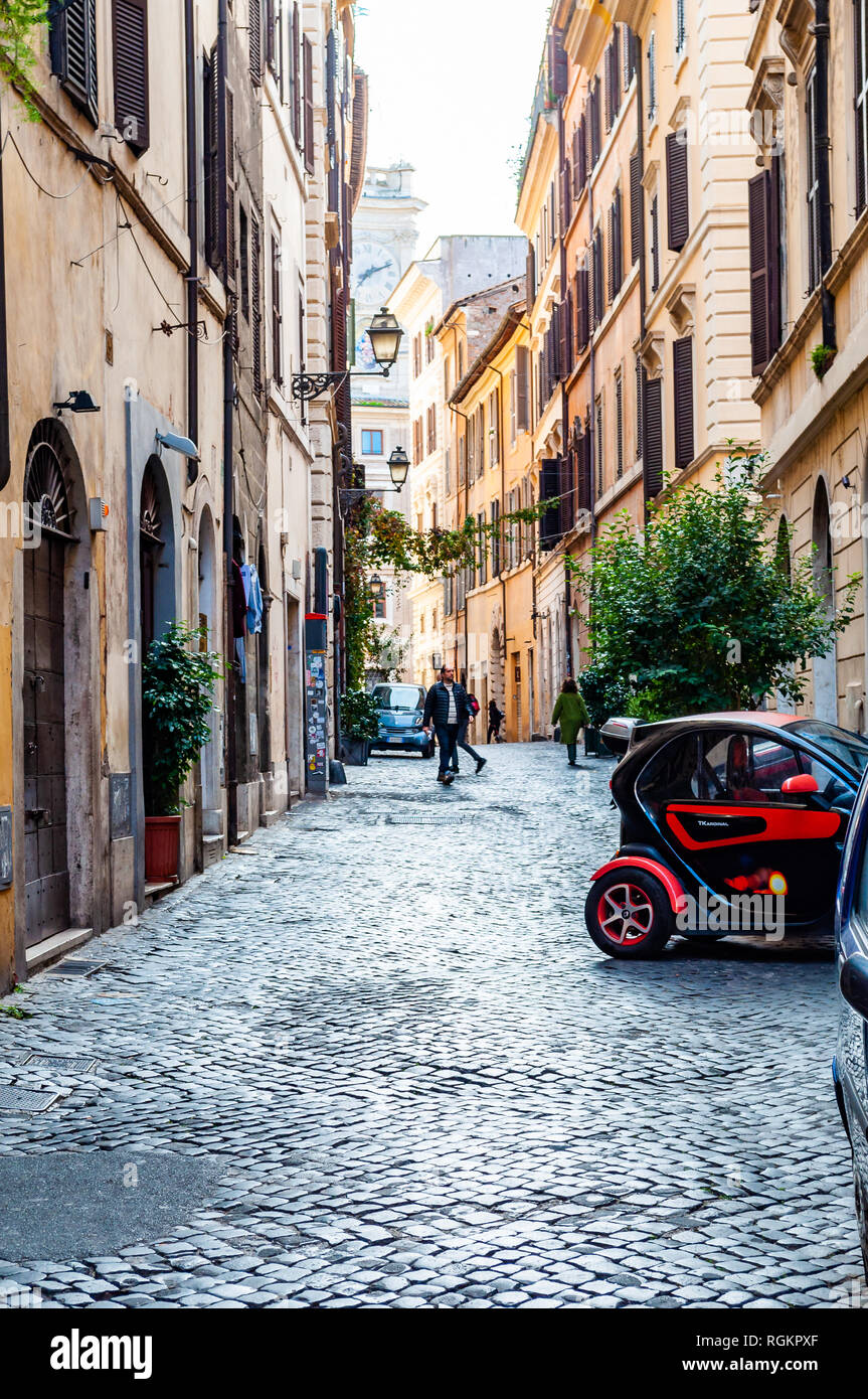 Rome, Italy - November 18, 2018: People walking by the ancient medieval ...