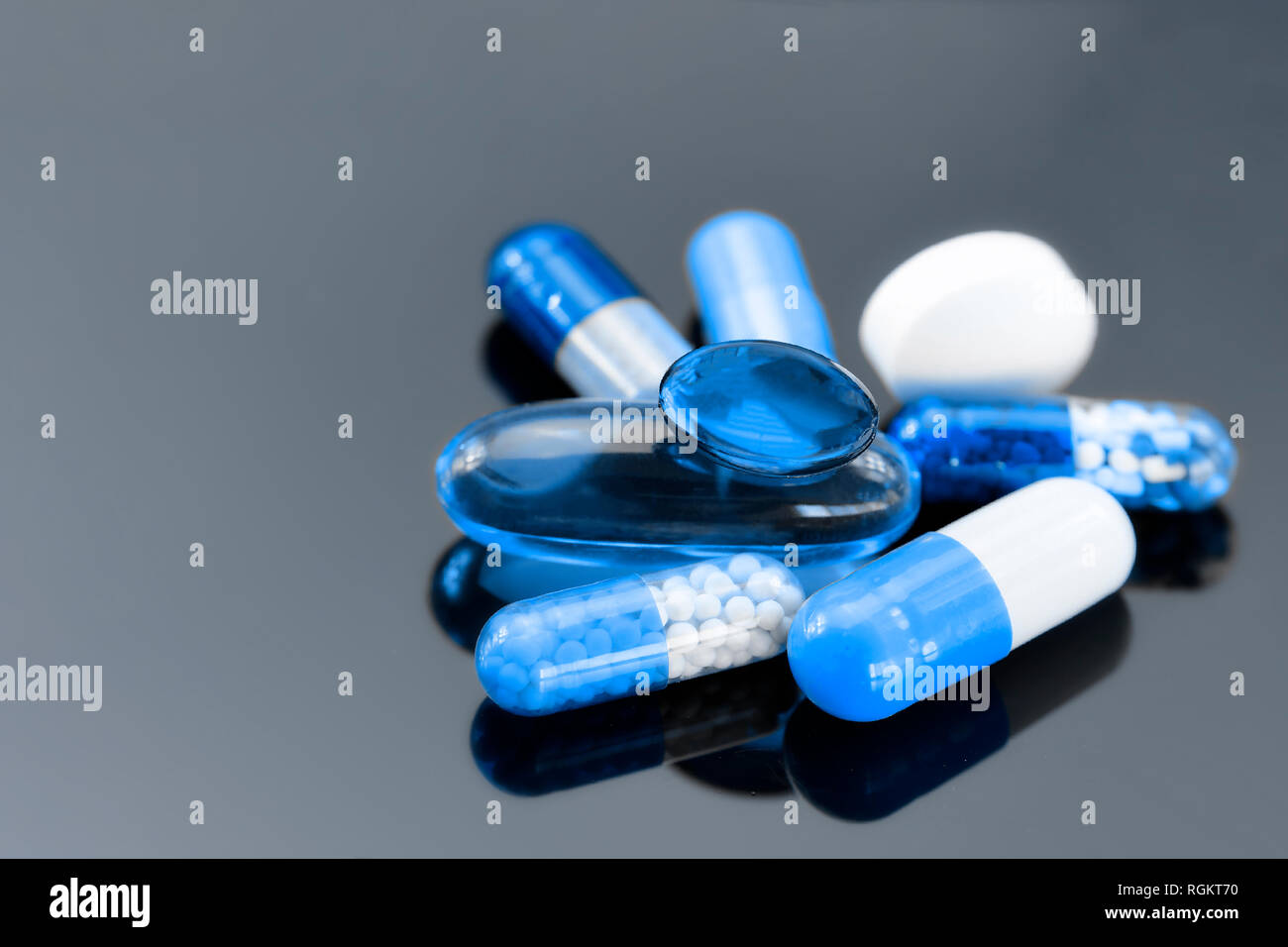 Colorful of oral medications on dark background. Capsule and tablet ...