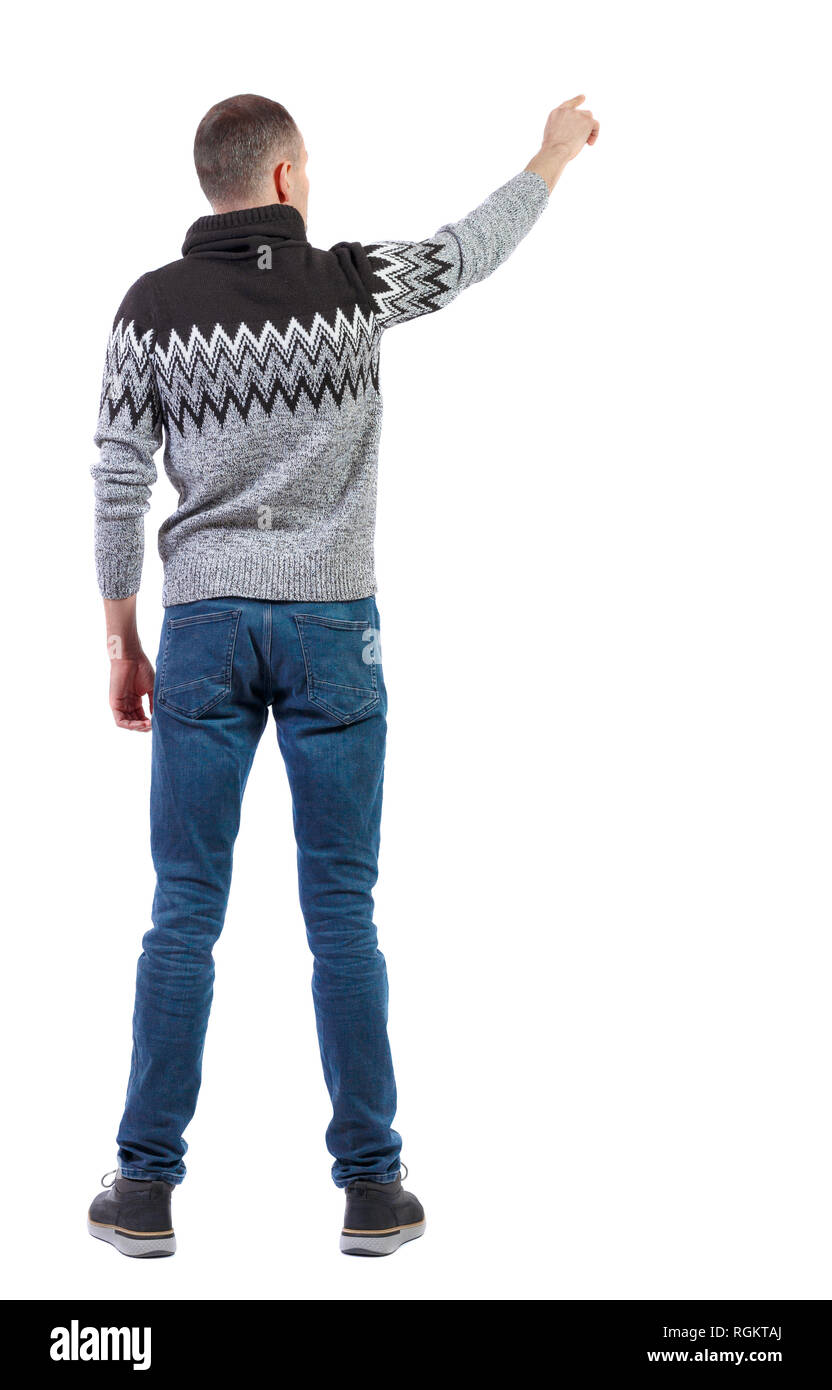 Back view of a stylish man in a sweater points his hand upwards. Rear ...